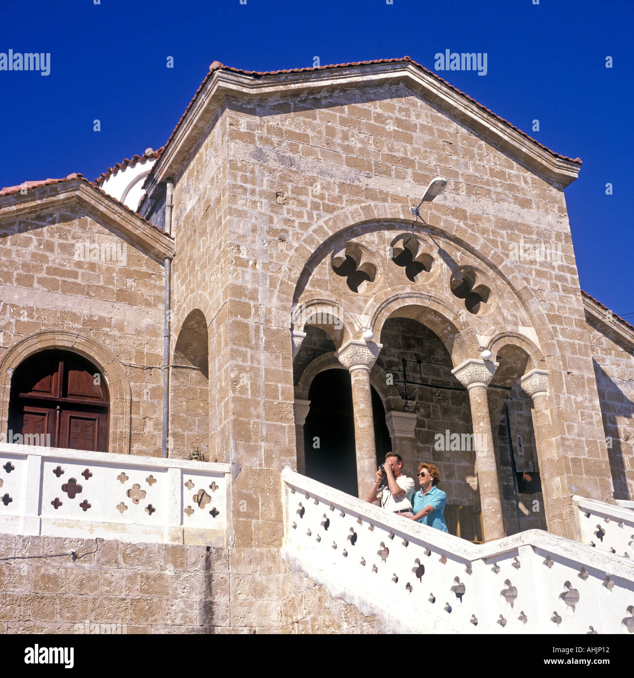 TOURISTS VISITING OLD CHURCH IN PAPHOS CYPRUS Stock Photo - Alamy