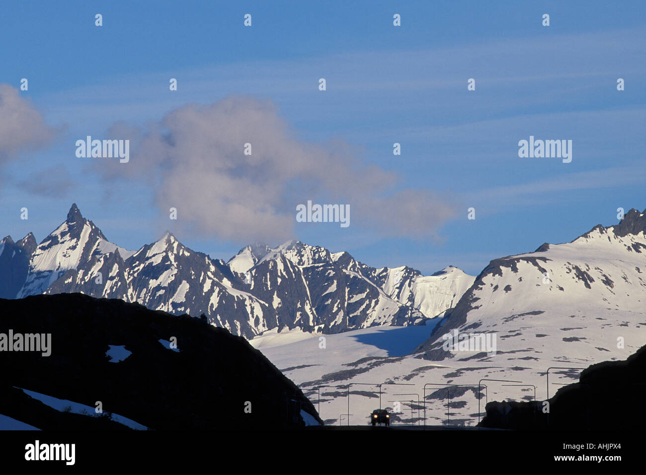 USA Alaska Chugach National Forest Lone car crests Thompson Pass along ...