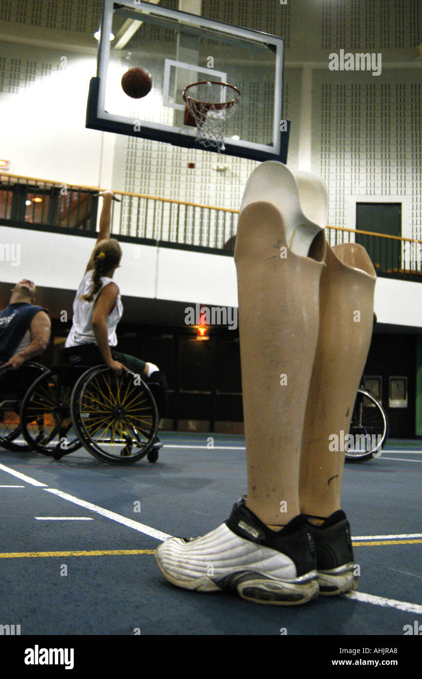 Detached Prosthetic legs sit on basketball court in front of owner as ...