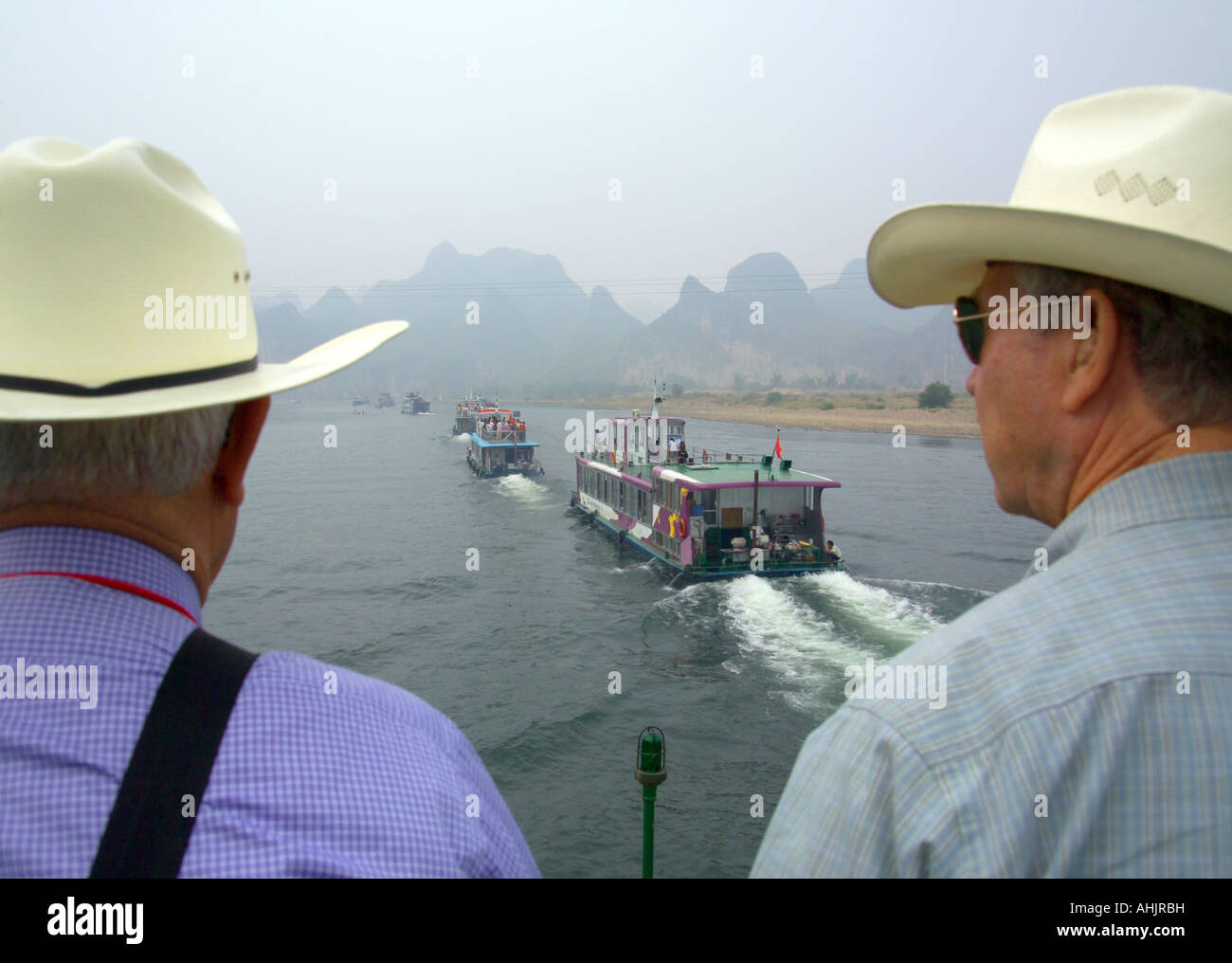 tourists watching boat convoy on the Li River Stock Photo - Alamy