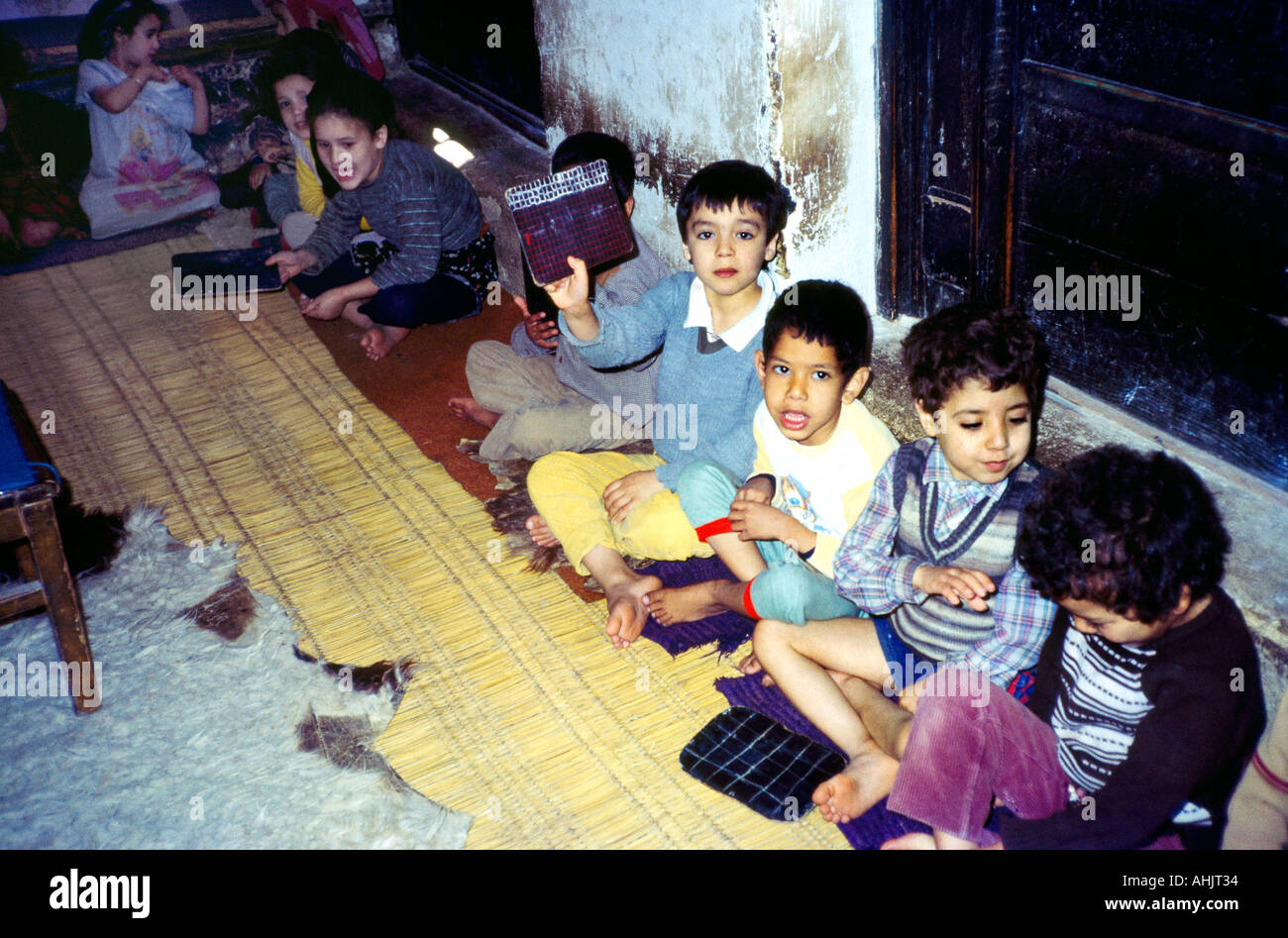 Fes Morocco Quranic School Children Sitting In Madrasa child with slate ...