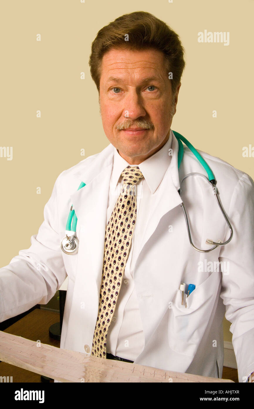 Doctor reading patient EKG in exam room Stock Photo - Alamy
