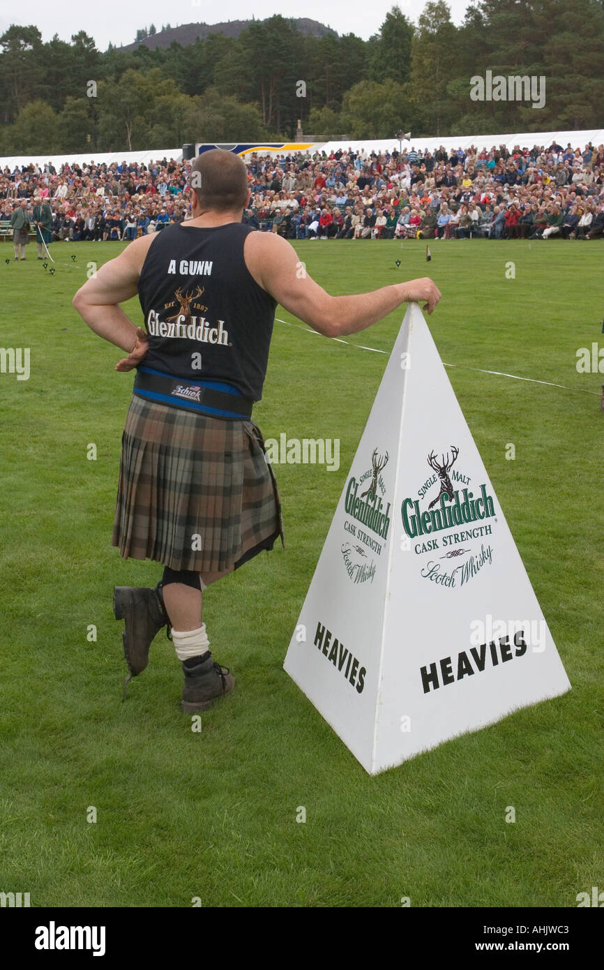 Scottish Highland Games - male heavy competitor with sponsors logo ...