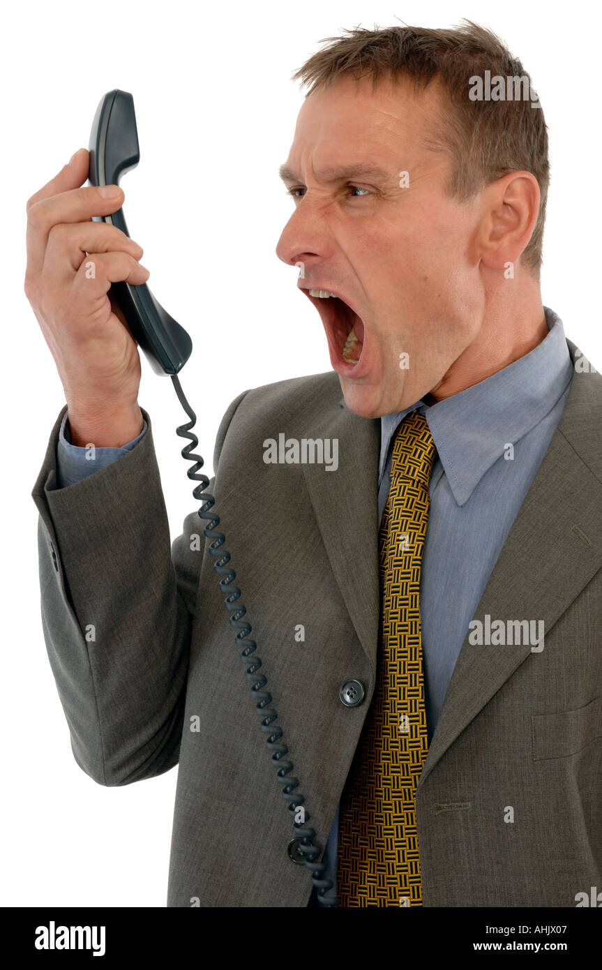 Businessman shouting down a phone Stock Photo - Alamy