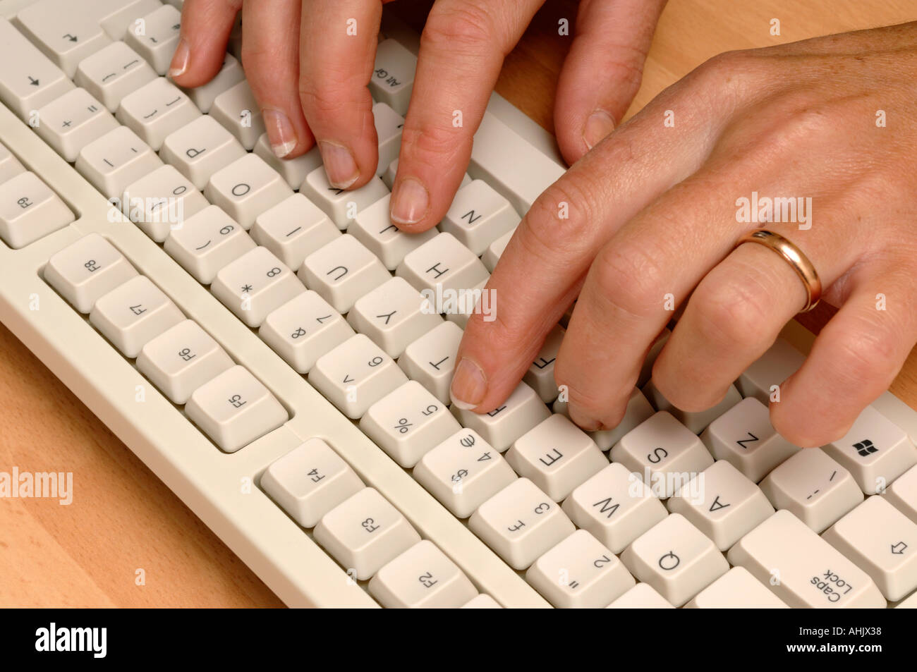 Womans hands typing on a computer keyboard Stock Photo - Alamy