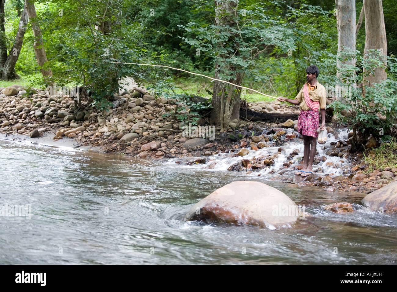 Muthuvan tribal fishing in wild stream in the Chinnar Wildlife ...