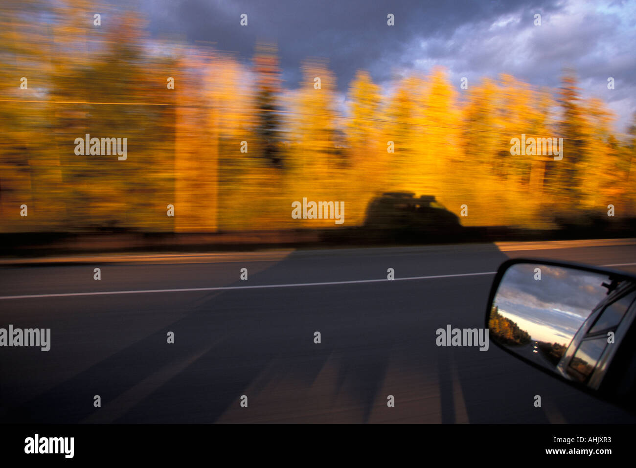 Canada British Columbia Sunset casts van s shadow on fall colored trees ...