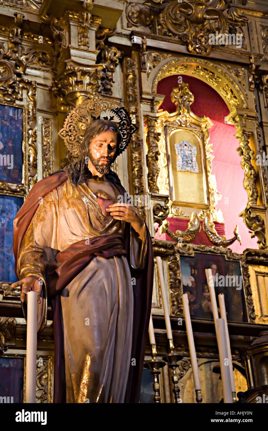 Statue of Jesus with fish symbol in background Malaga cathedral Spain ...