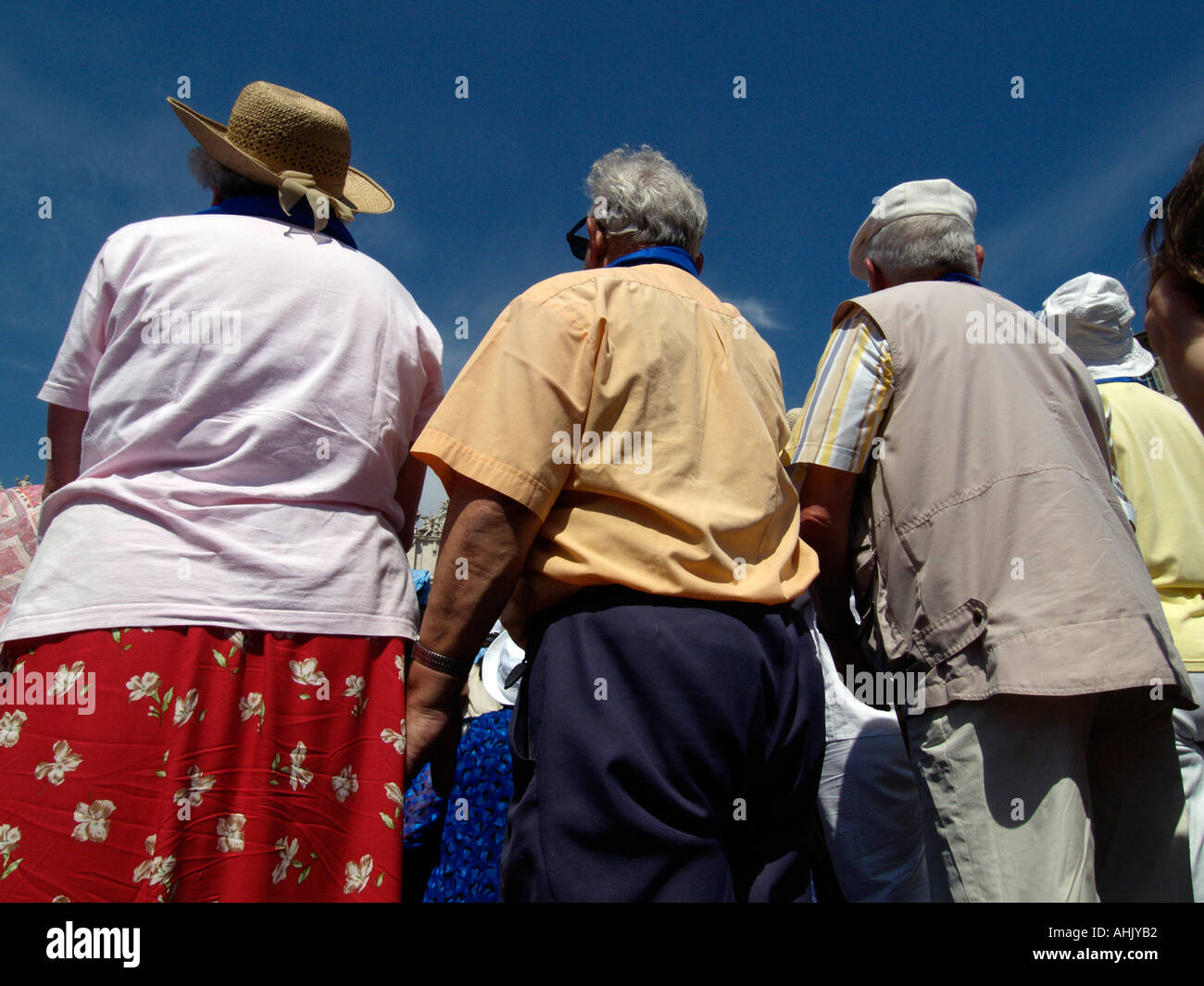 three elderly people in St Peters Square seen from behind Stock Photo ...
