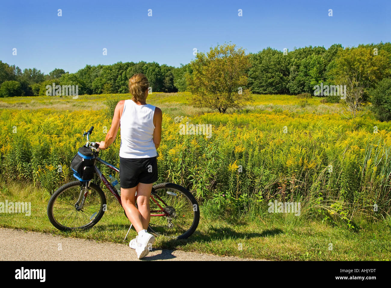 Woman riding bike on nature hi-res stock photography and images - Alamy