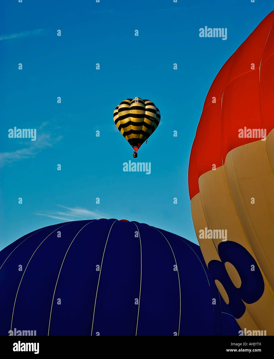 Hot air balloons taking off for a flight into a blue sky Stock Photo ...
