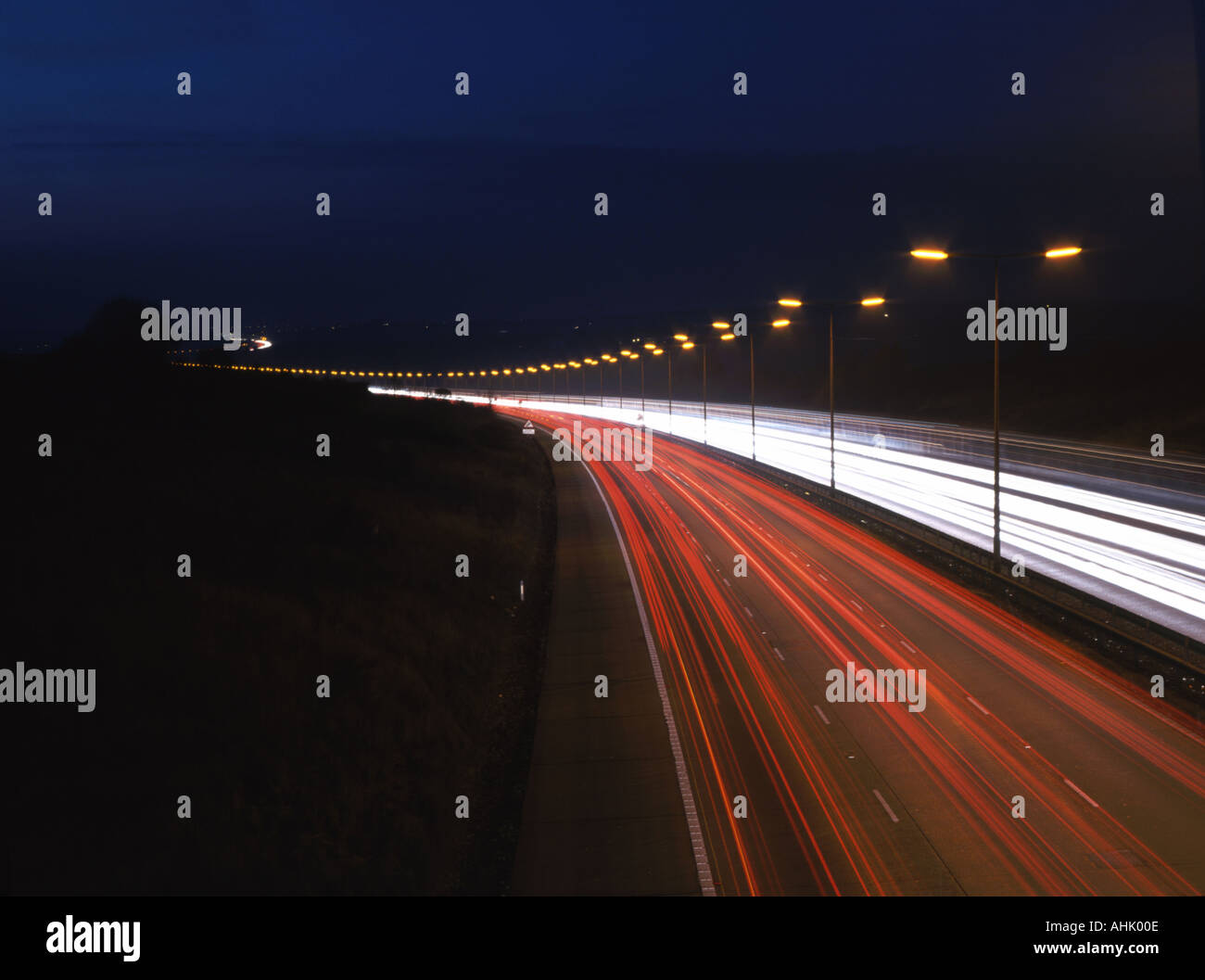 vehicle light trails at night on the M25 motorway Essex Stock Photo - Alamy