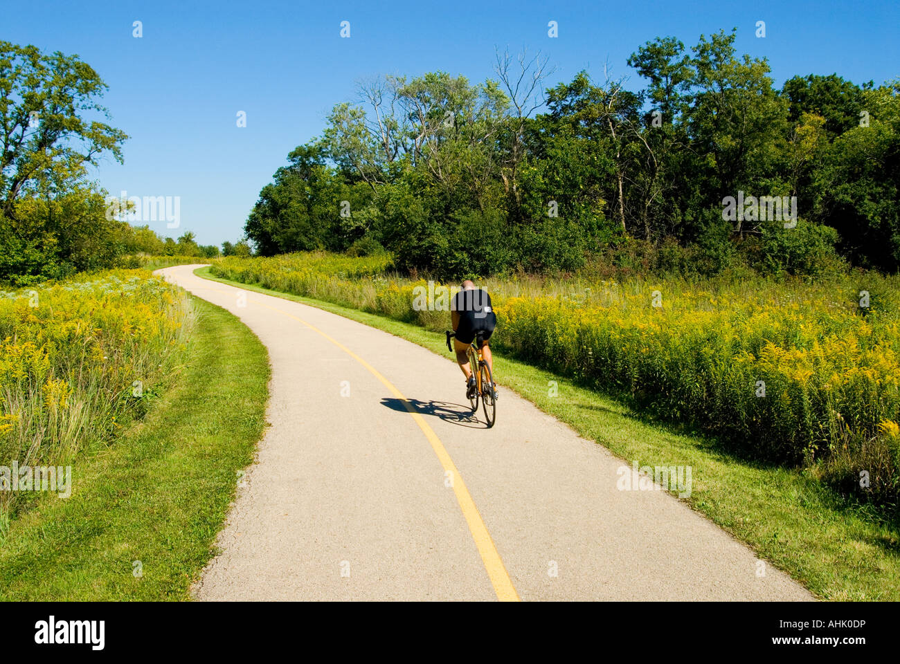 Bicycle Rider Speeding up path Stock Photo - Alamy