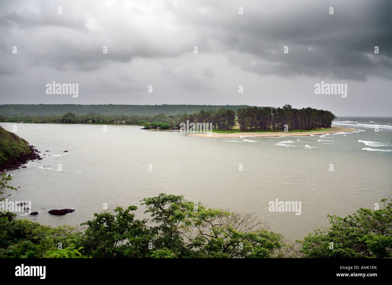 Querim Beach and Tiracol River estuary under monsoon clouds. View from ...