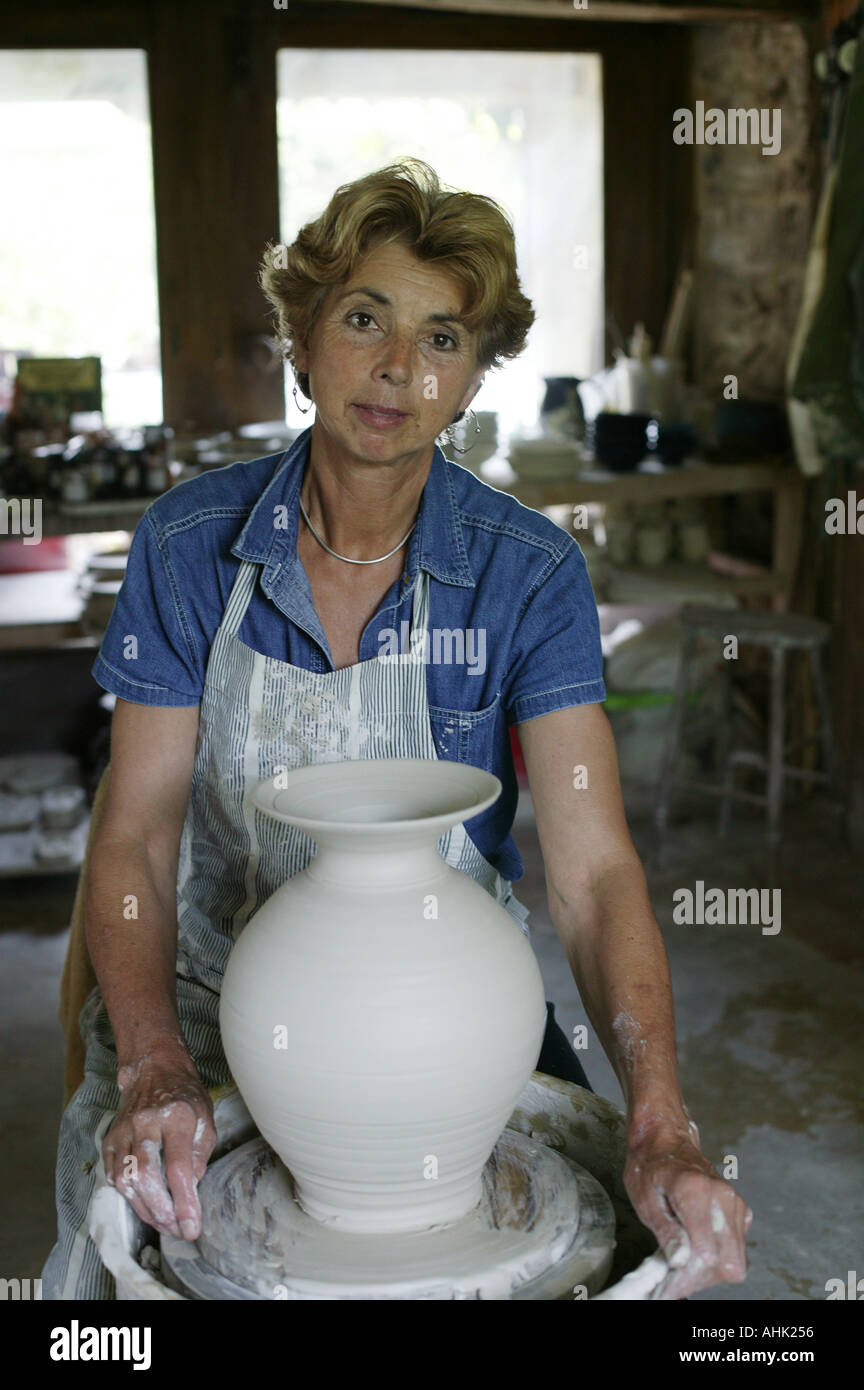 woman potter throwing a pot potters wheel craft pot pottery wheel clay ...