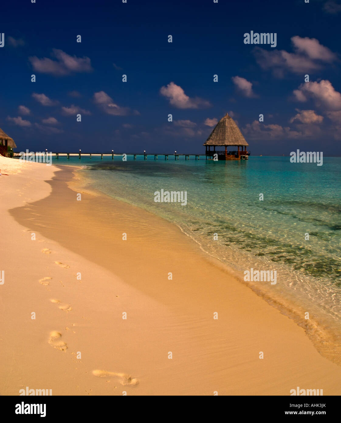 Footprints in the powder white sand on Angaga Island in the Maldives ...