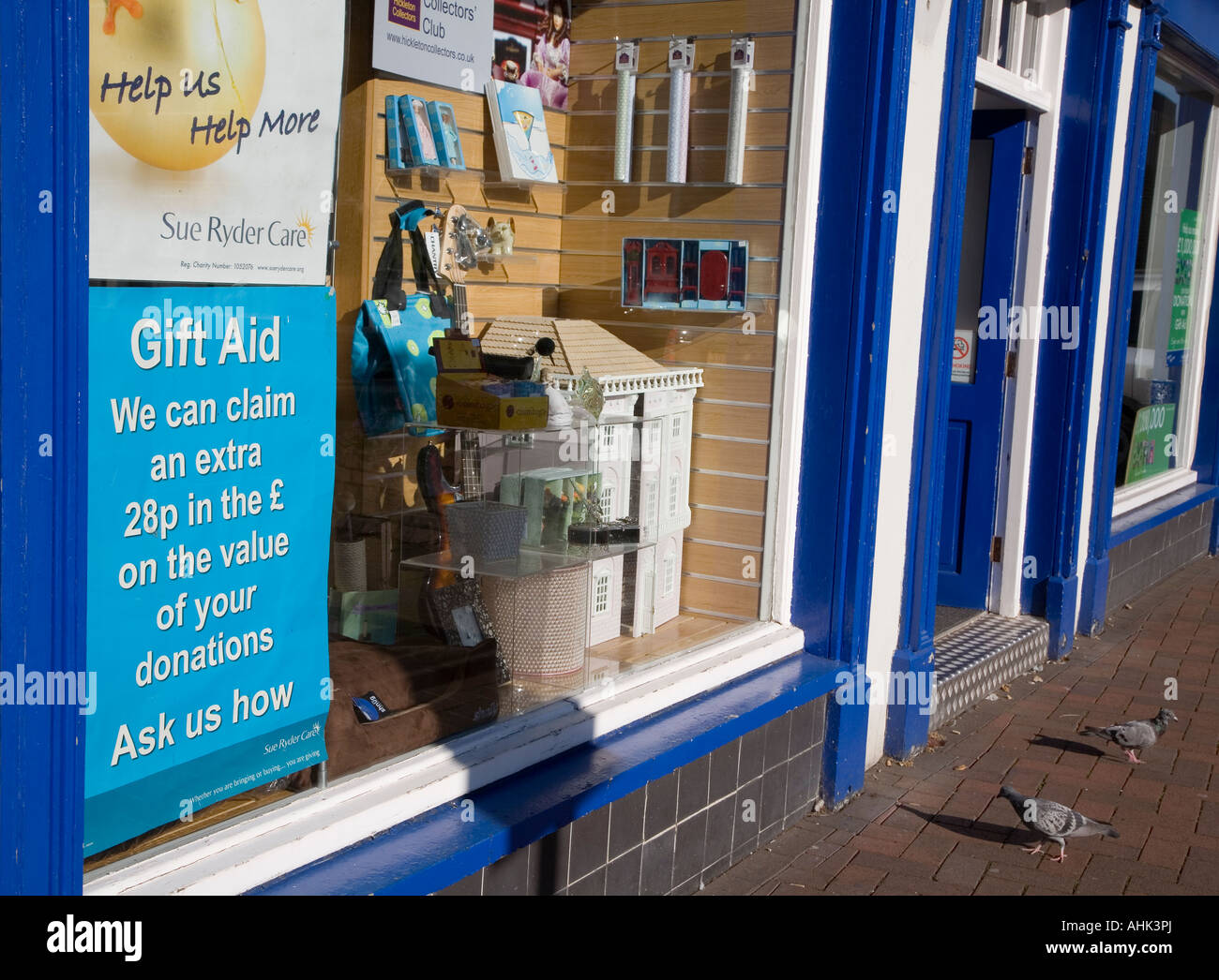 Poster in charity shop window hi-res stock photography and images - Alamy