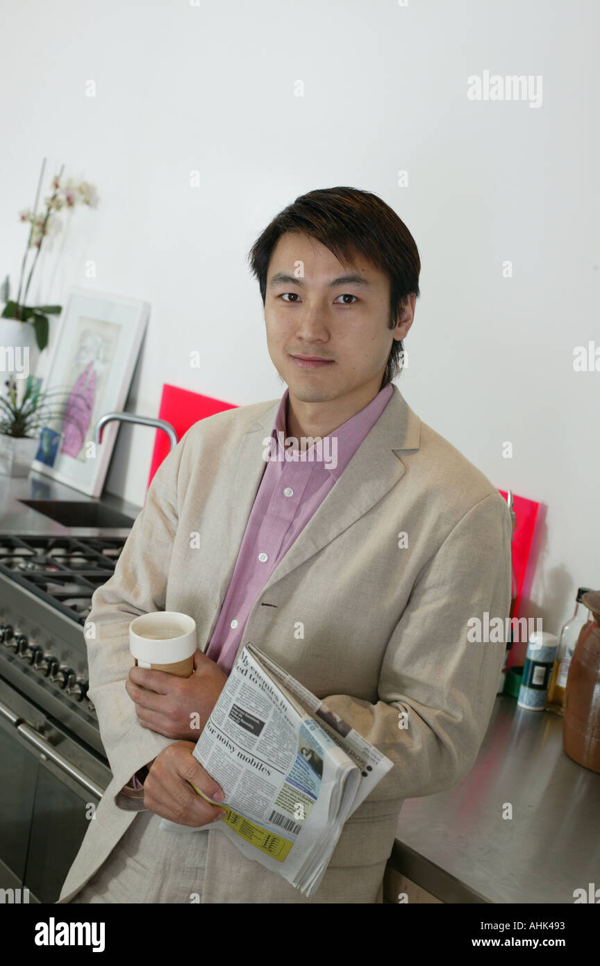 Asian man newspaper hi-res stock photography and images - Alamy