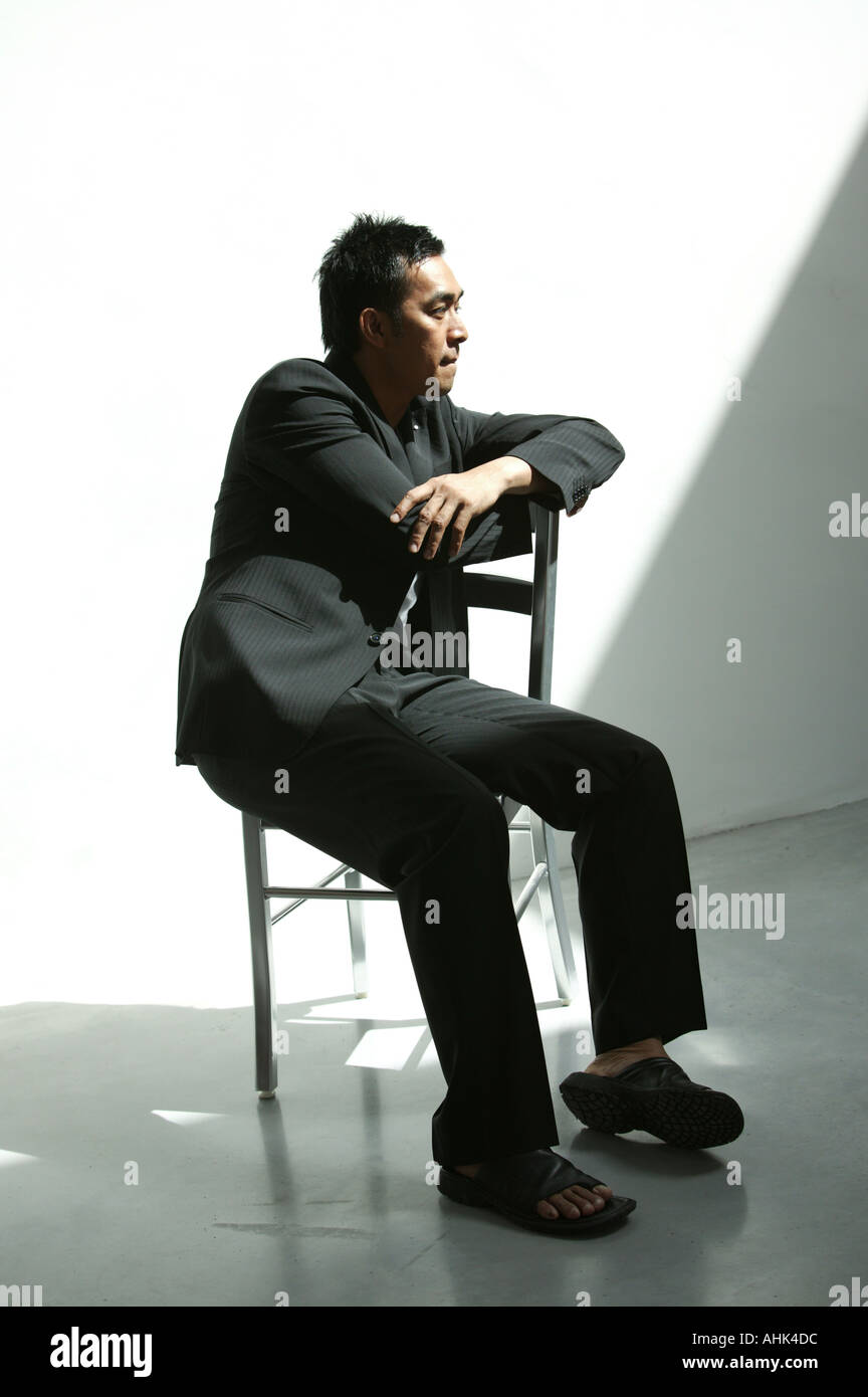Asian man sitting suit 25 30 years Man One Man Only Man Alone Seated ...
