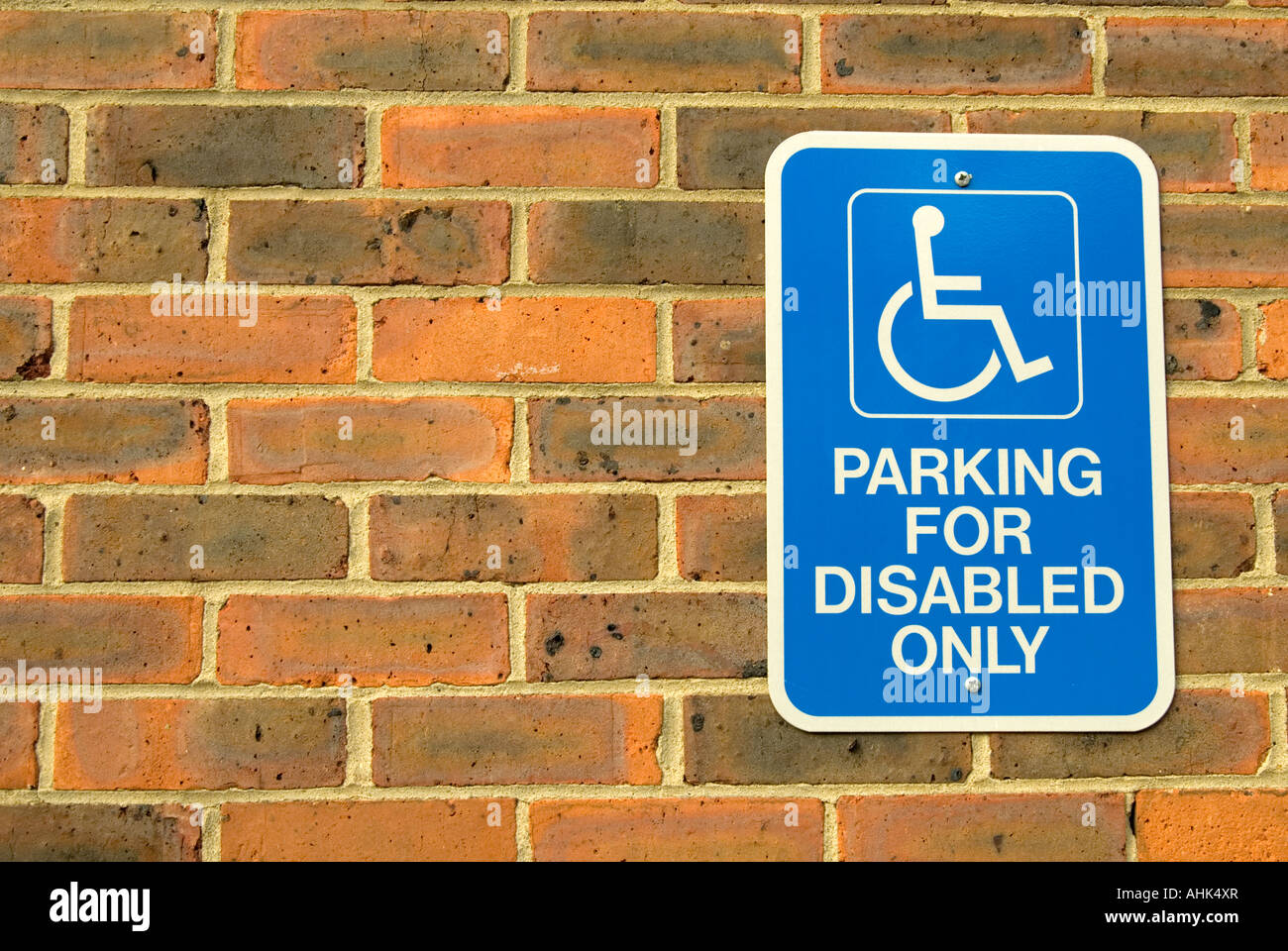 parking for disabled only sign on a brick wall Stock Photo - Alamy