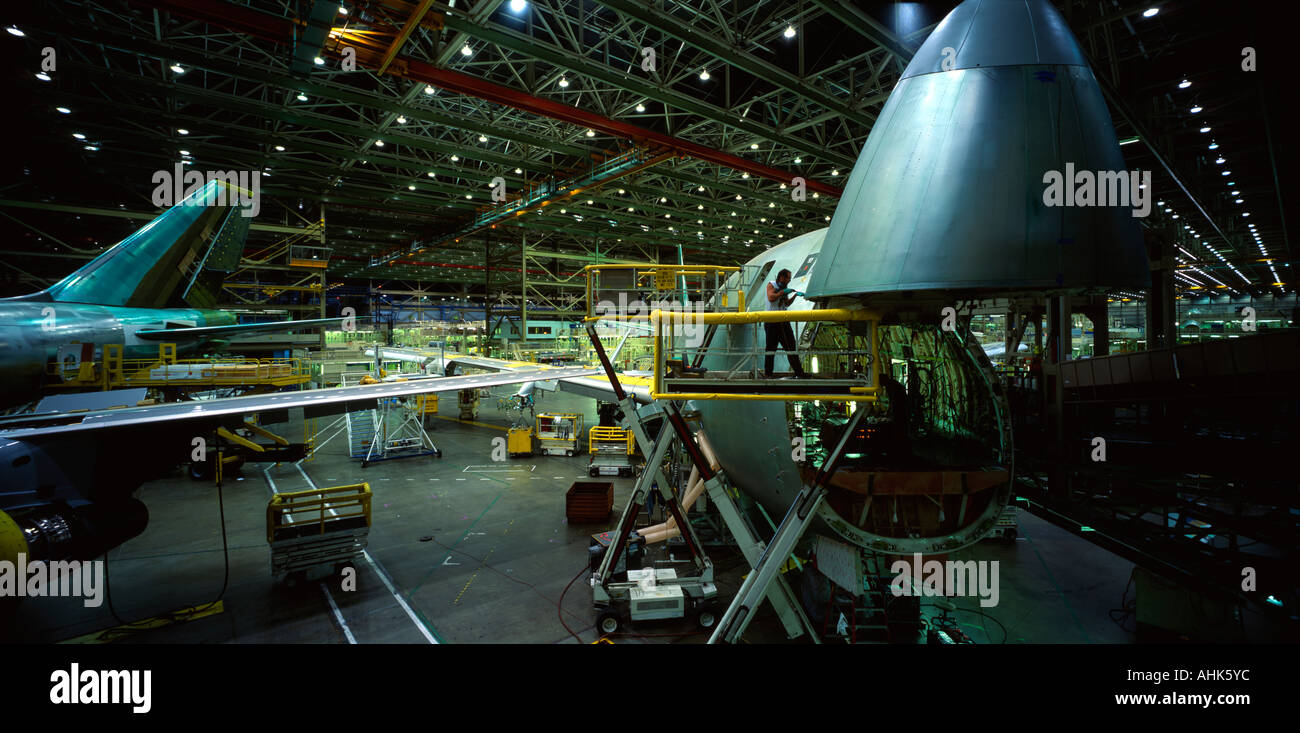 USA Washington Everett Boeing worker inserts rivets into upturned nose ...