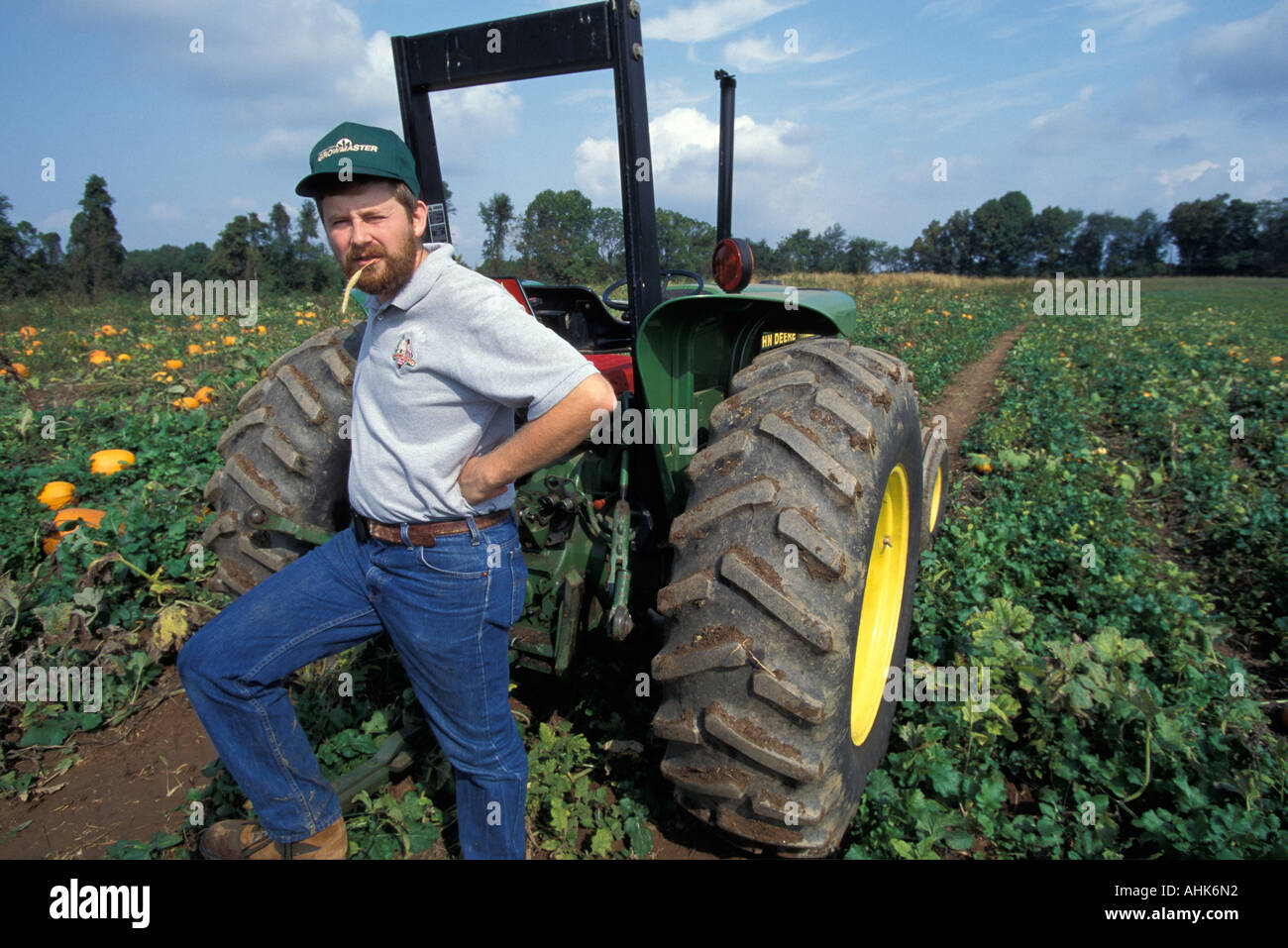 USA Maryland MR Edwin Remsberg stands by tractor at Belvedere Farm near ...