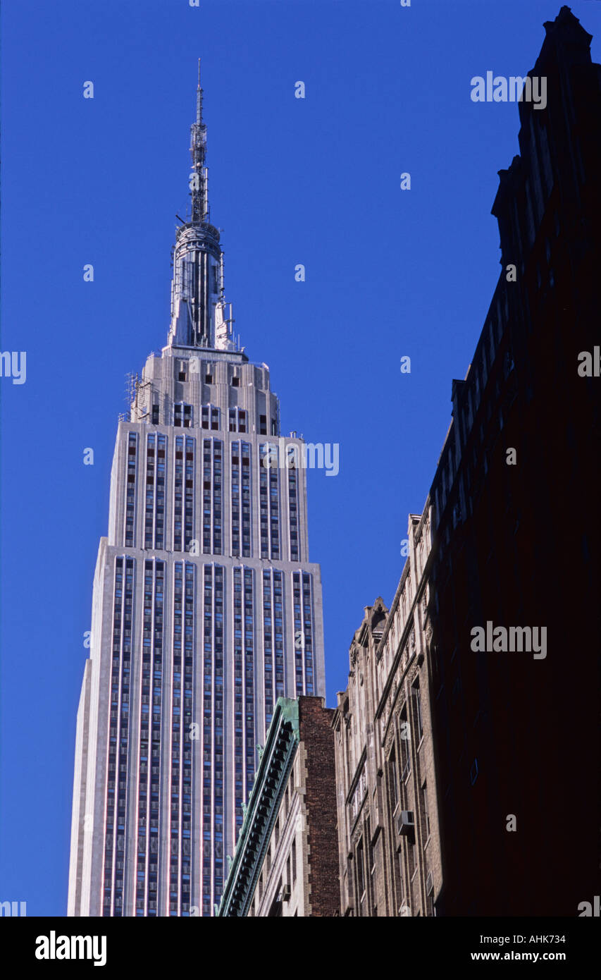 The Empire State Building viewed from street level framed by other ...