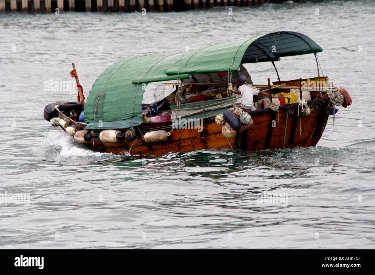 Small junk boat harbor hi-res stock photography and images - Alamy