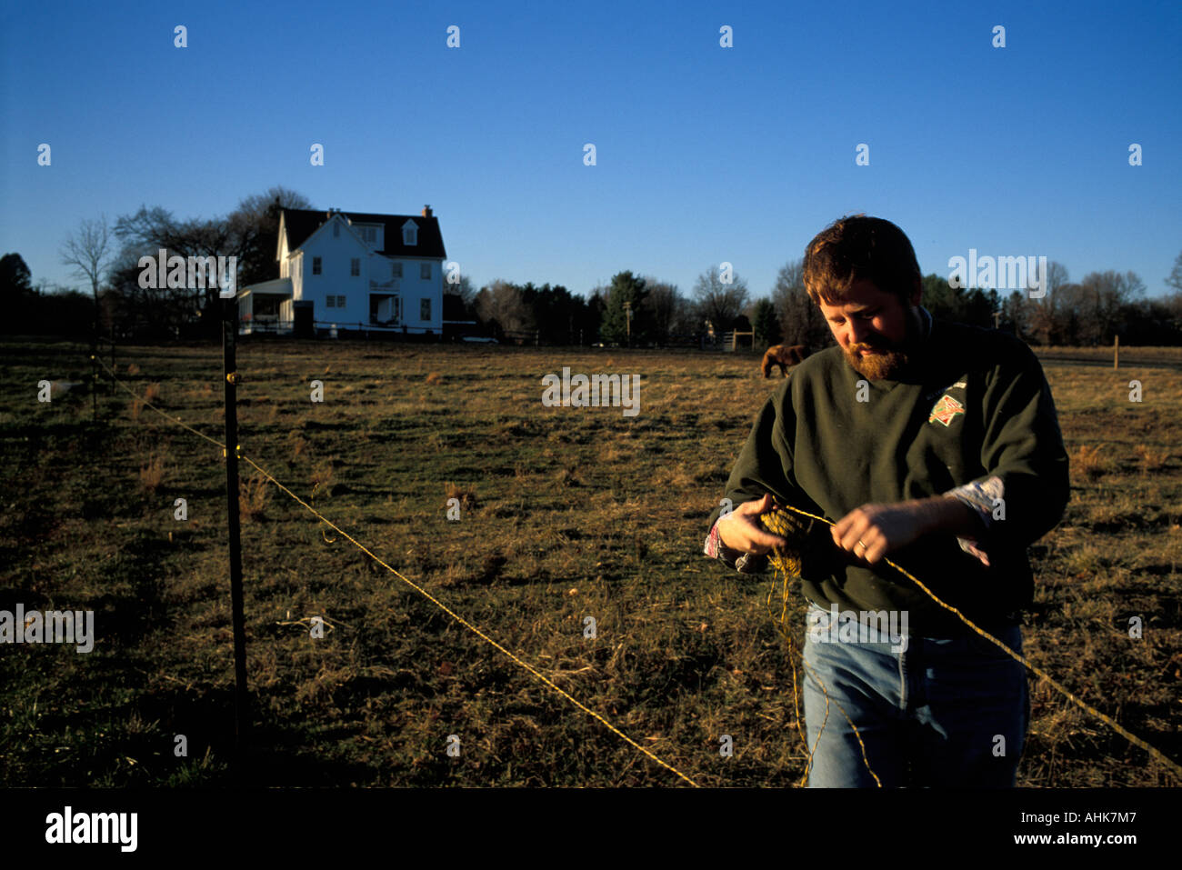 USA Maryland Fallston MR Edwin Remsberg works on electrical fence on ...