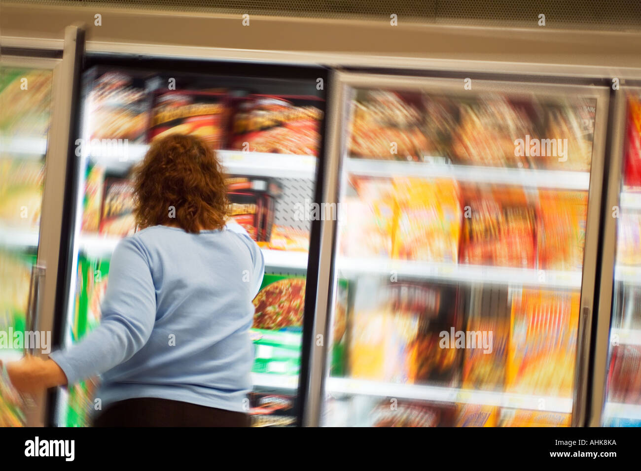 Heavy woman grocery freezer hi-res stock photography and images - Alamy