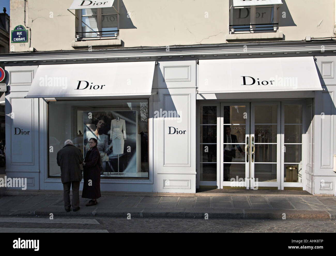 senior couple outside Cristian Dior shop Paris France 16, Rue de l ...