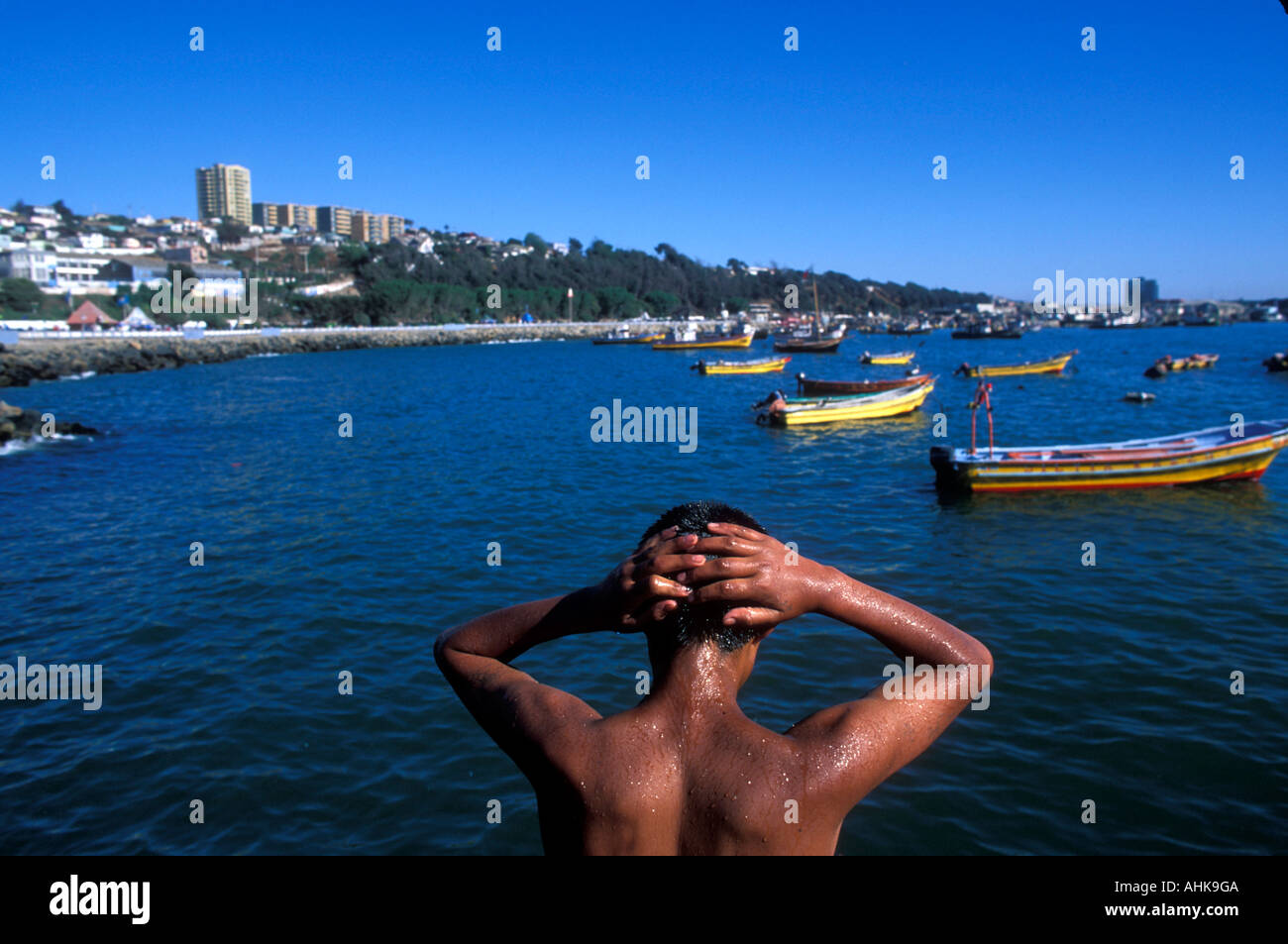 Chile Boys swim into chilly harbor in coastal town of San Antonio west ...