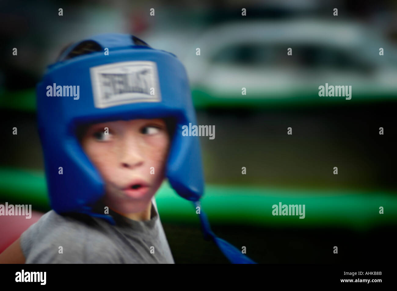 Kid learning to fight with headgear for protection Stock Photo - Alamy
