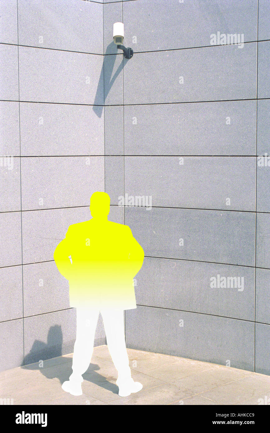 Man under CCTV camera Stock Photo - Alamy