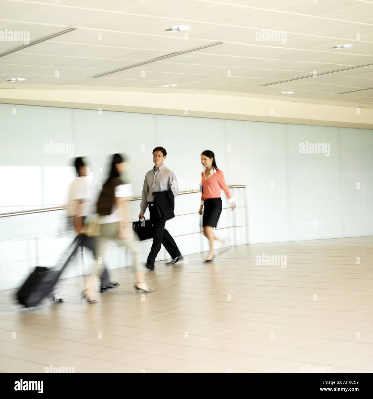 People walking down corridor, motion Stock Photo - Alamy