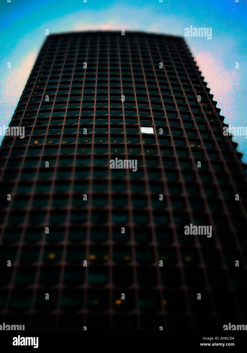 One light on in building Stock Photo - Alamy
