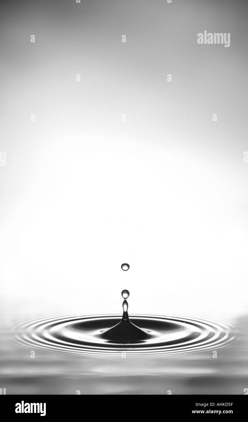 water drop on water surface Stock Photo - Alamy