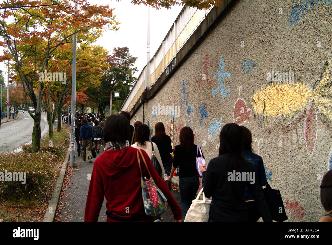Doshisha University students walking to the university on an autumn ...