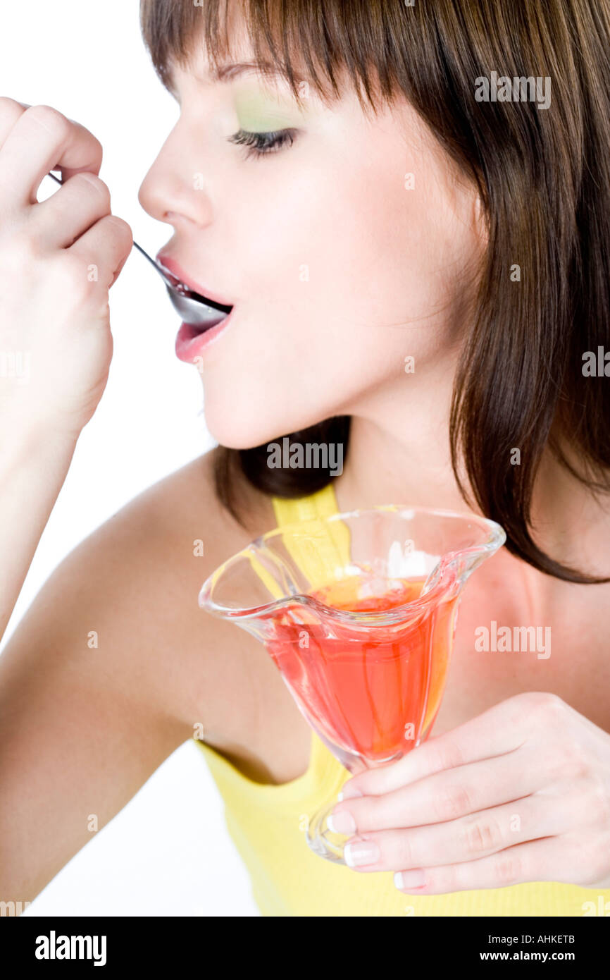 young woman eating jelly Stock Photo - Alamy
