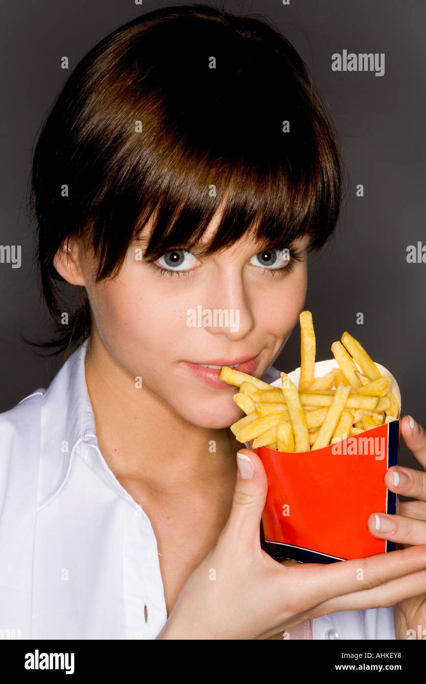 young woman with fries Stock Photo - Alamy
