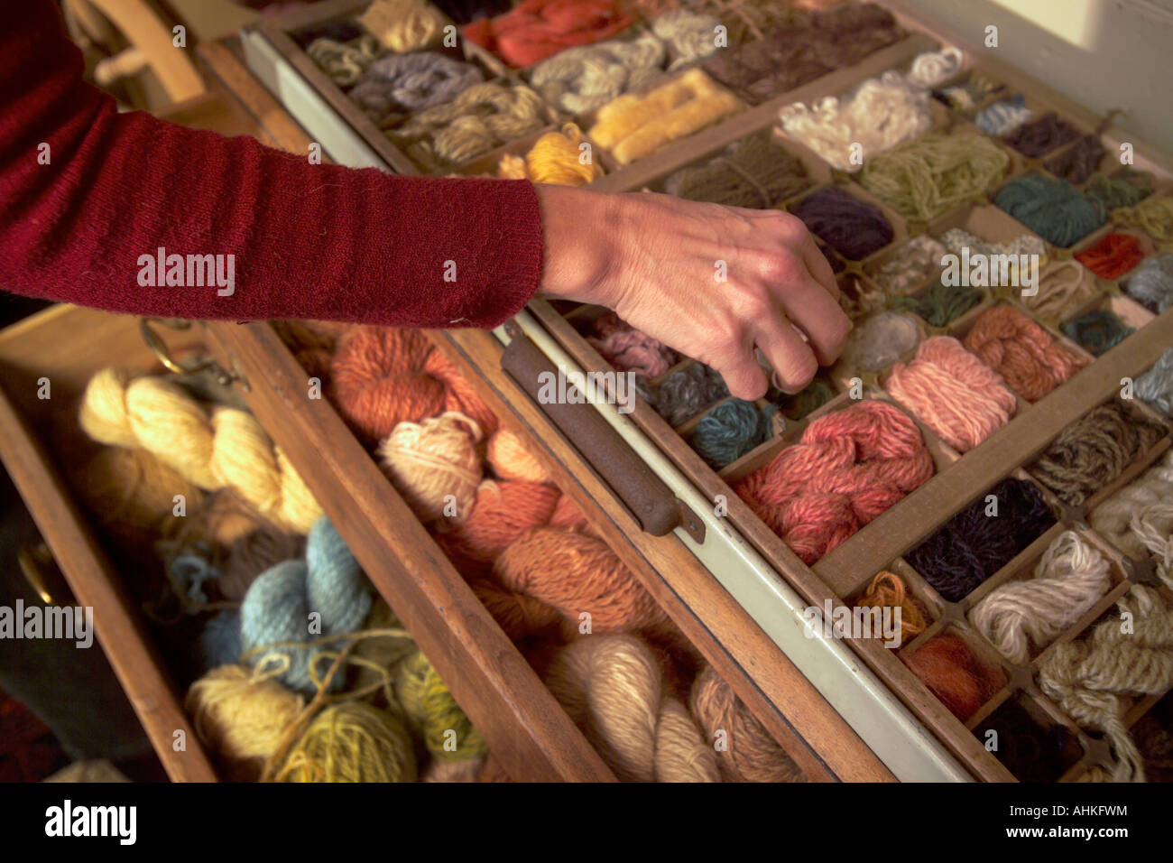 Woman's hands working with woollen thread Stock Photo - Alamy