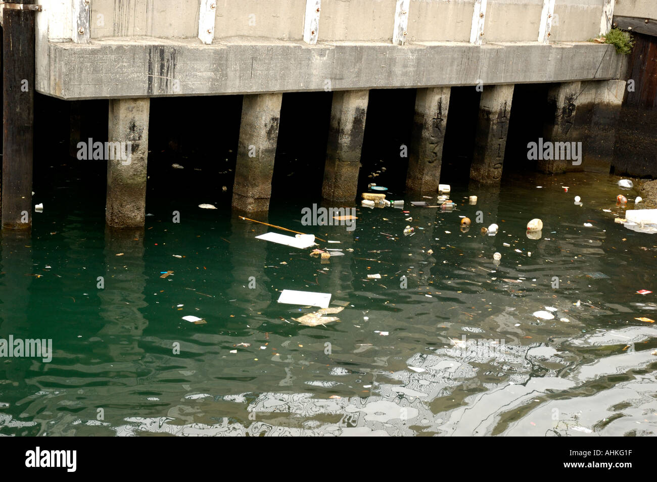 Garbage in water in a populated area Stock Photo - Alamy