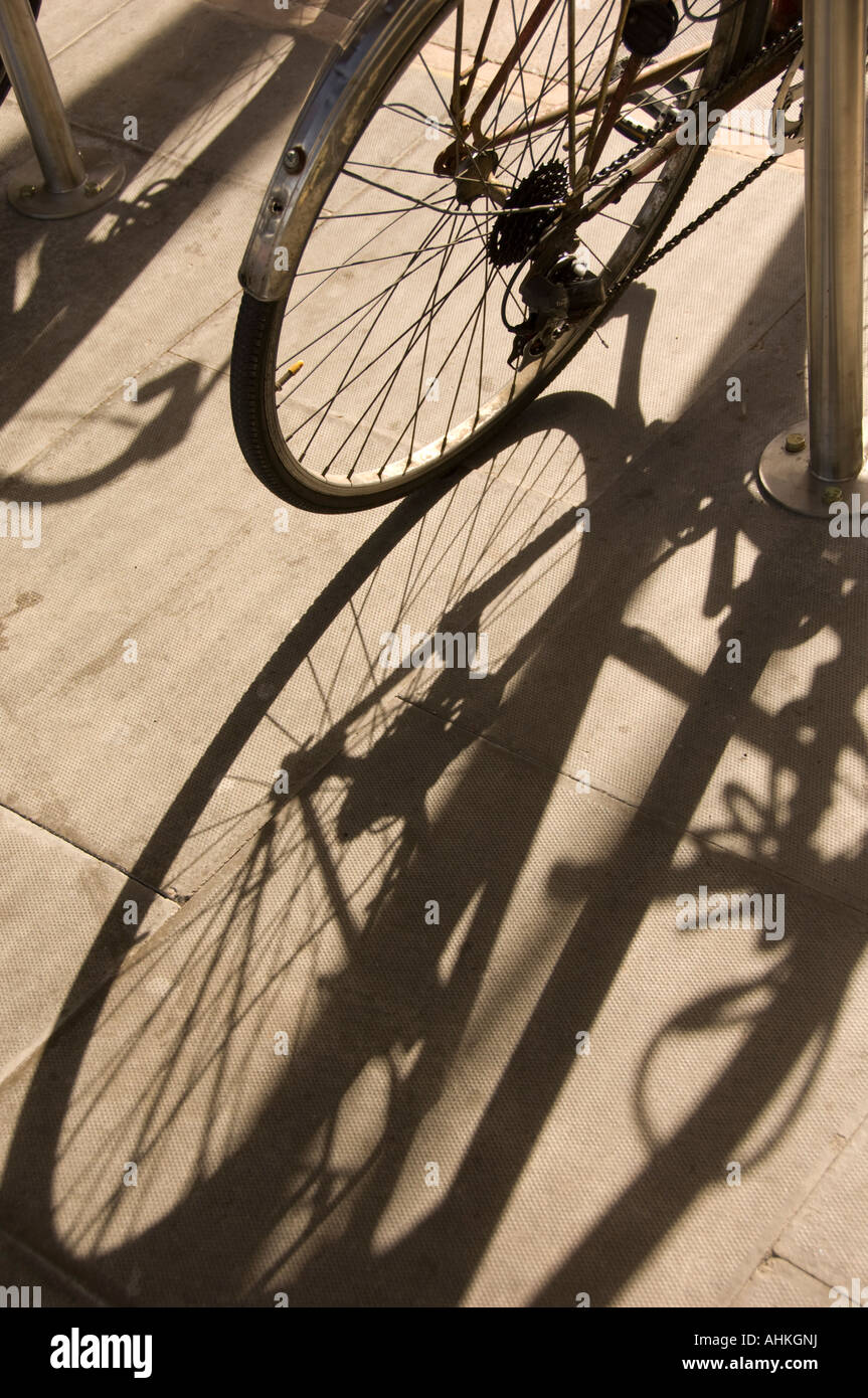 bicycle shadow on pavement - concept shot for green eco friendly urban ...