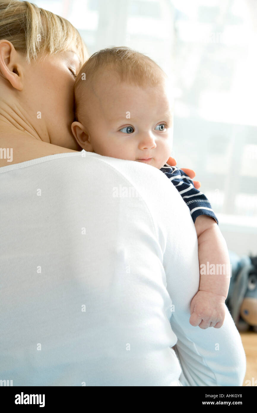 mum carrying baby Stock Photo - Alamy