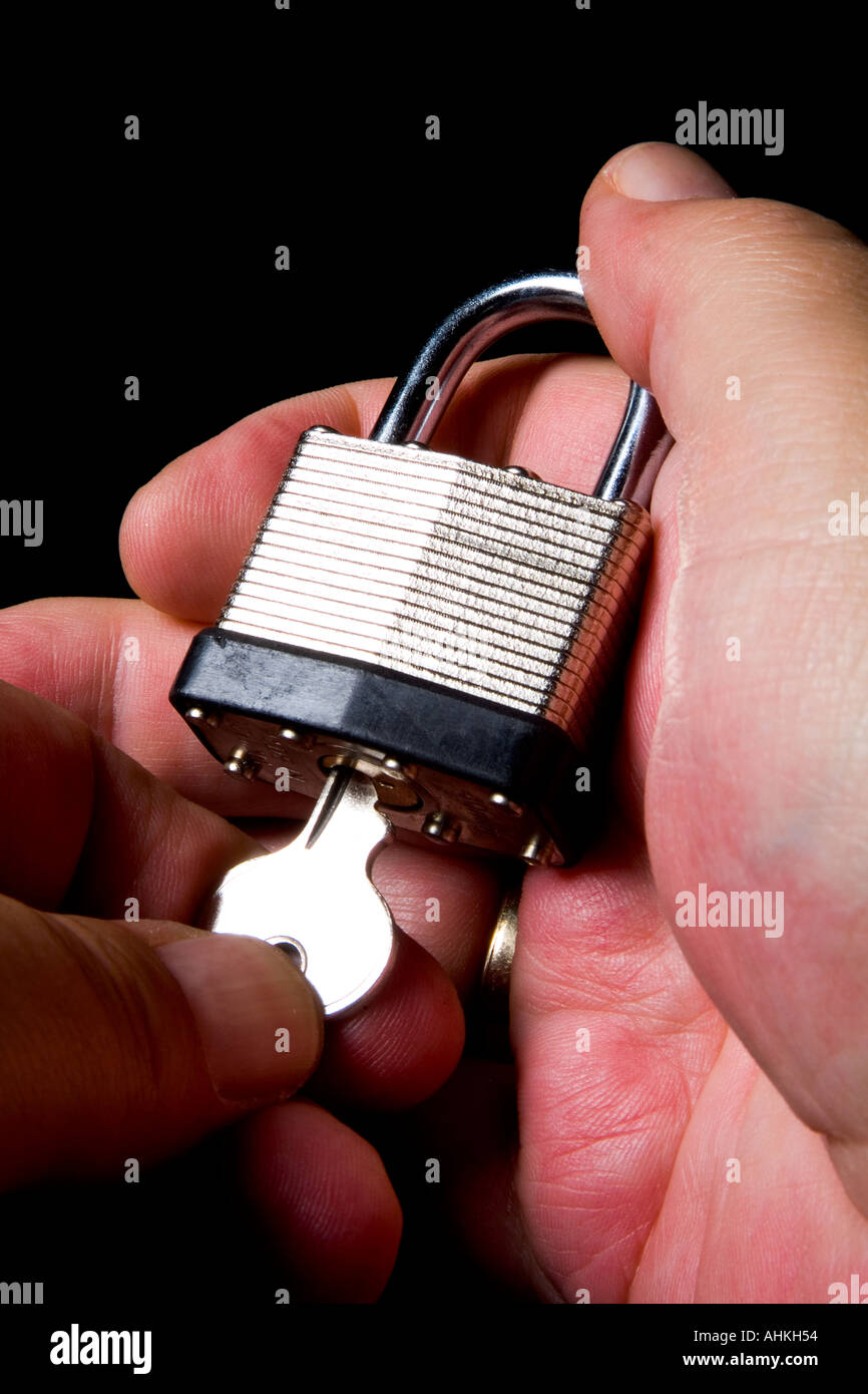 Hands unlocking padlock with key Stock Photo - Alamy Hands unlocking padlock with key Stock Photo - Alamy
