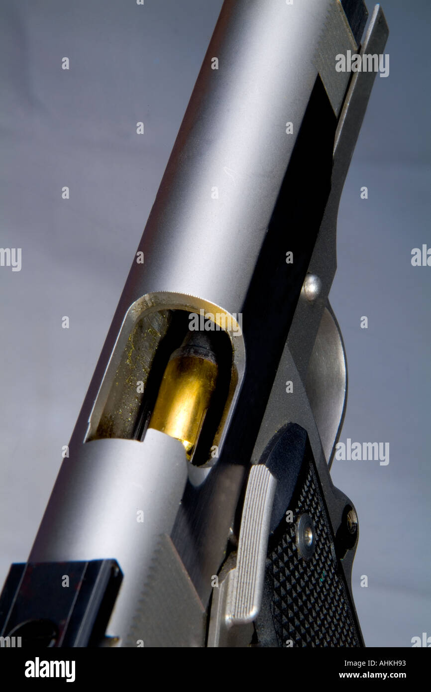 Open handgun slide with visible bulet in breech Stock Photo - Alamy