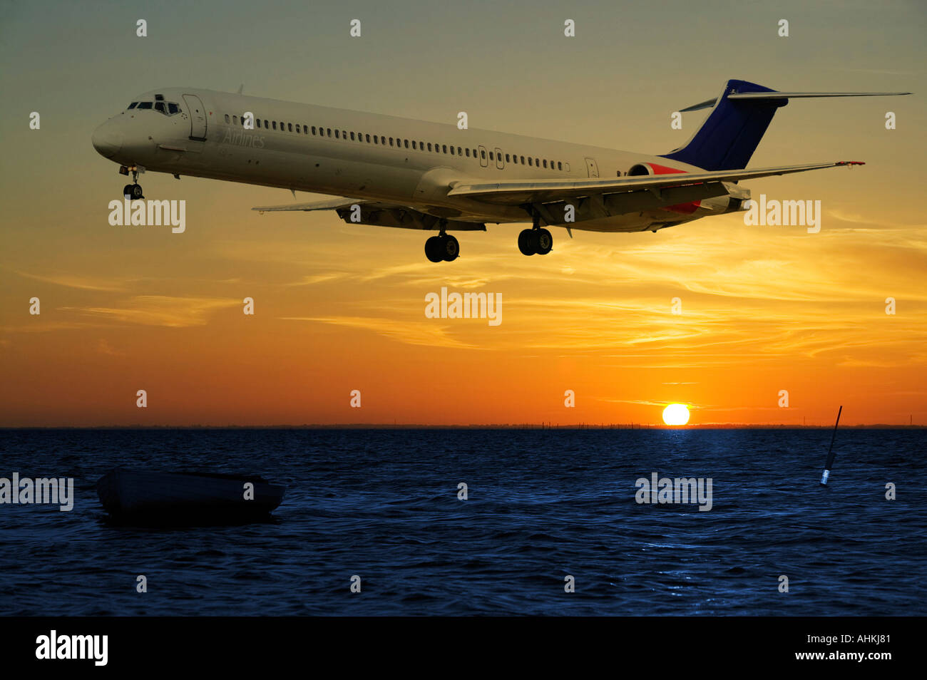 Airplane in sunset ready for landing Stock Photo - Alamy