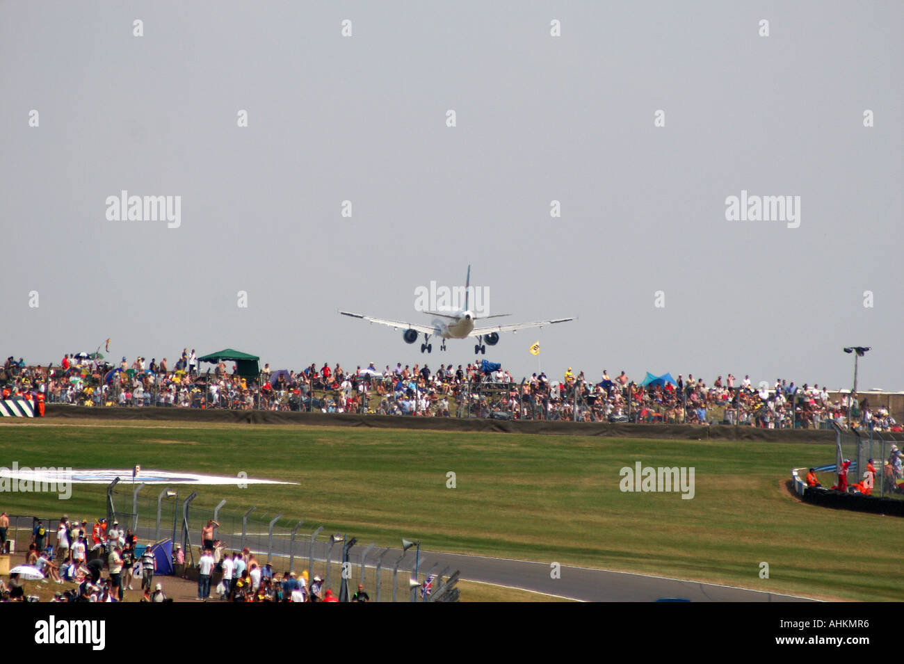 Passenger jet passing close over the heads of people at Donnigton Park ...