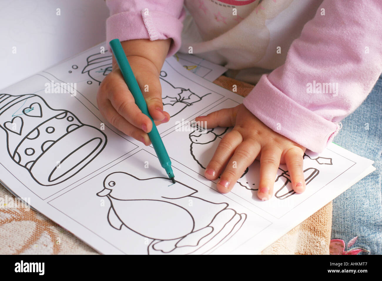 Child colouring in a book hi-res stock photography and images - Alamy