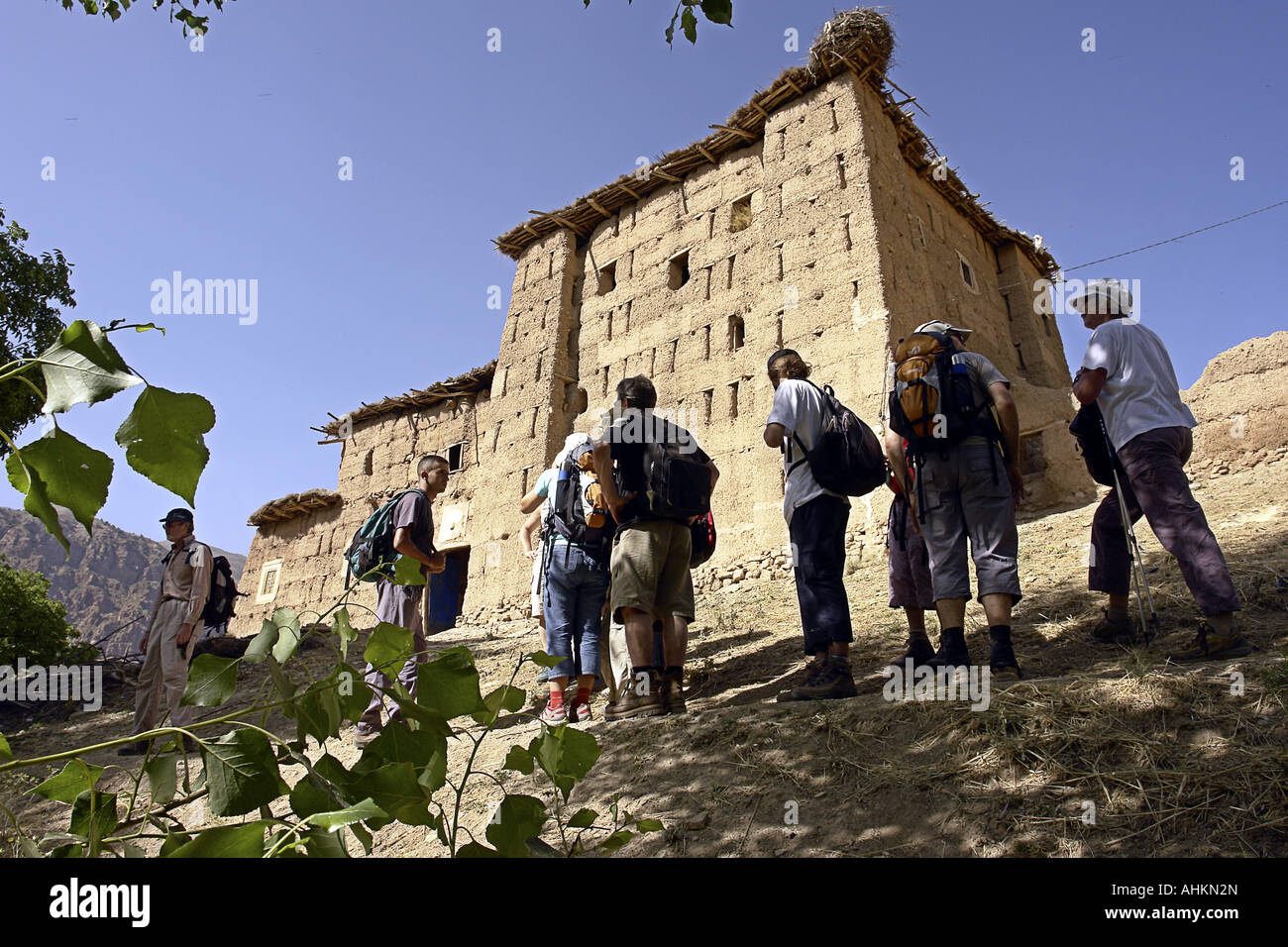 Hikers in front of an old granary Aït Bouguemez valley High Atlas ...